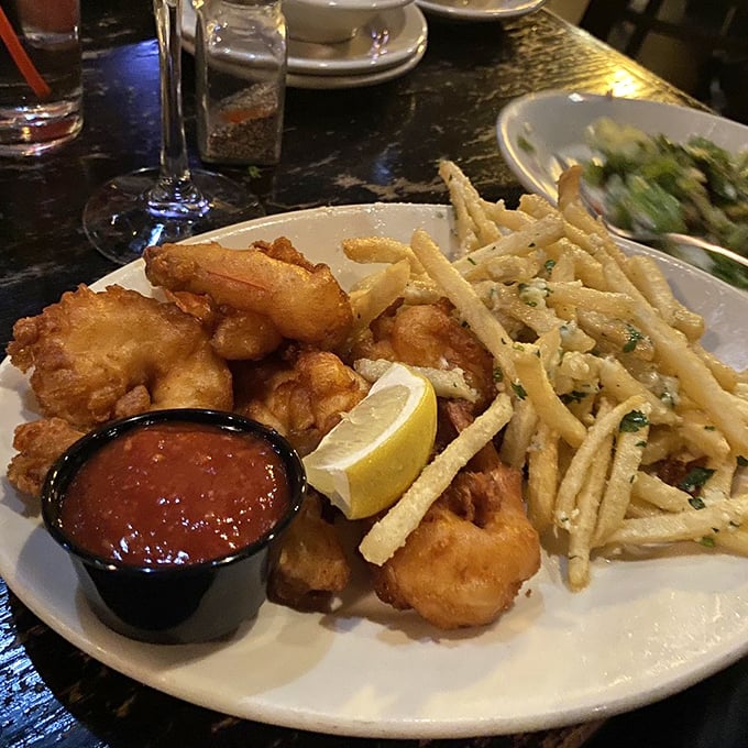 Golden-battered shrimp huddle next to their sophisticated cousins – truffle fries that elevate the humble potato to rock star status.