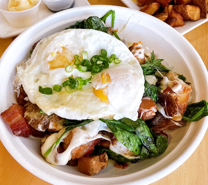 The aptly named Kitchen Sink—where breakfast ingredients gather for a delicious summit meeting. That perfectly fried egg is the chairperson of this tasty committee.