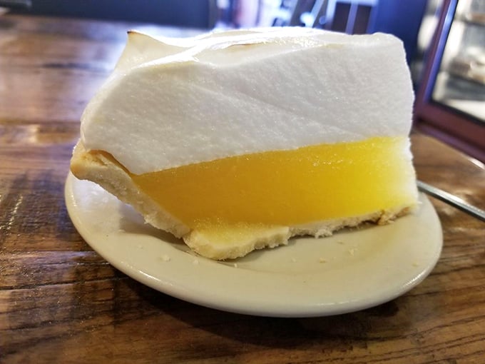 The lemon meringue pie doesn't need Instagram filters—that cloud of meringue floating above sunshine-yellow filling has been stopping conversations mid-sentence for decades.