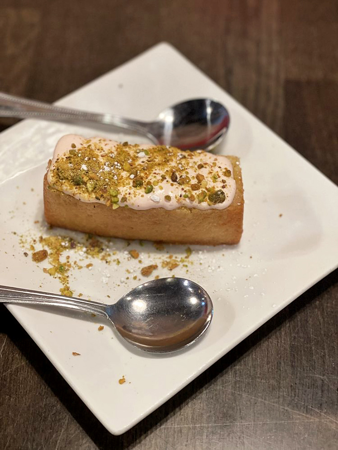 Lemon cake topped with strawberry cream and pistachios—the sweet finale that somehow leaves room for "just one more pierogi" next time.