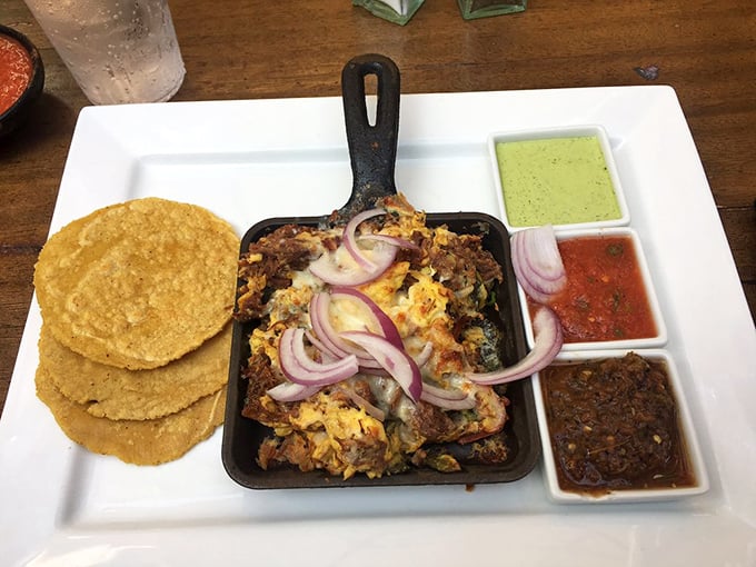 These aren't just tacos—they're tiny flavor festivals served with condiments that turn each bite into a choose-your-own-adventure of deliciousness.