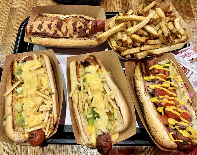 Hot dog heaven on a tray – a feast of different styles and toppings that invites exploration. Why choose one when you can try them all?