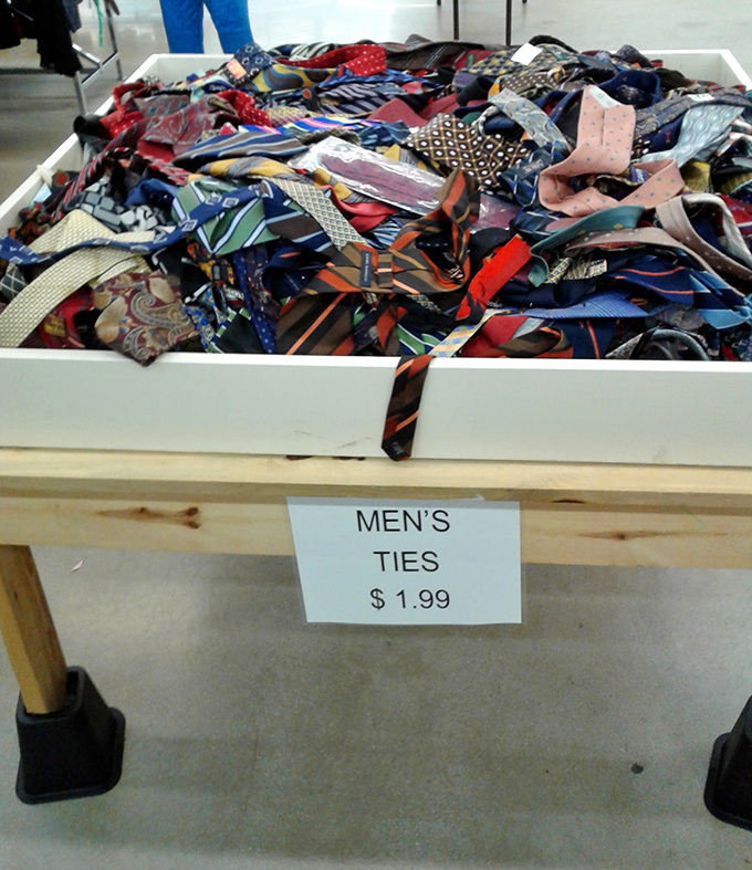 Men's ties bundled together like silk rainbows, ready to add professional flair affordably.