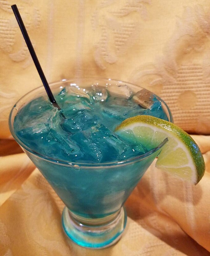 The Mermaid Water cocktail isn't just a pretty blue face—it's a refreshing counterpoint to the smoky flavors of Trout Town's famous barbecue.