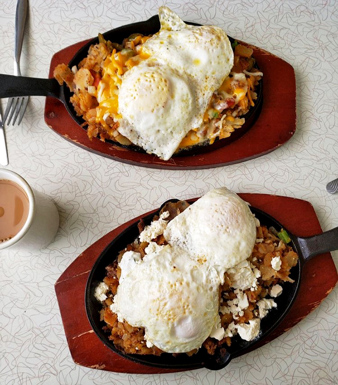 Breakfast skillets that could fuel a marathon—sizzling cast iron loaded with home fries, eggs, and enough cheese to make Wisconsin proud.