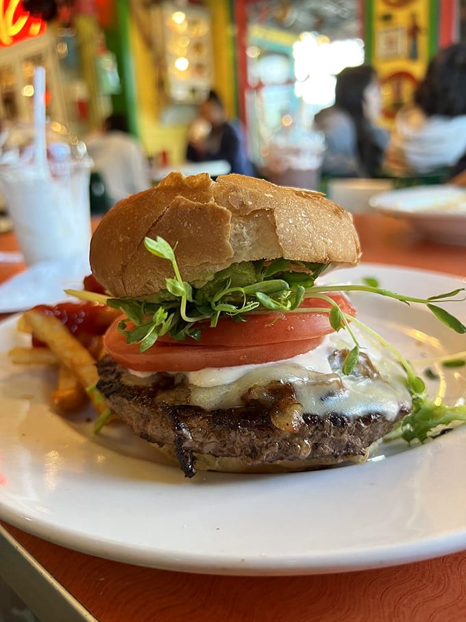 A burger that demands to be photographed before eaten. The melted cheese cascades down the patty like a dairy waterfall.