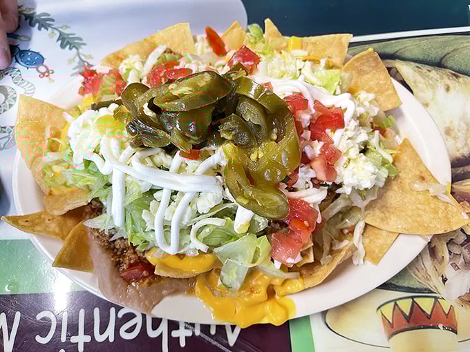 These nachos aren't the sad, soggy afterthought you find at ballparks. They're a proper meal, crowned with jalapeños like the royalty they are.