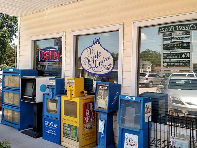 Newspaper dispensers outside—a charming reminder that some pleasures, like good food and local news, remain timeless.