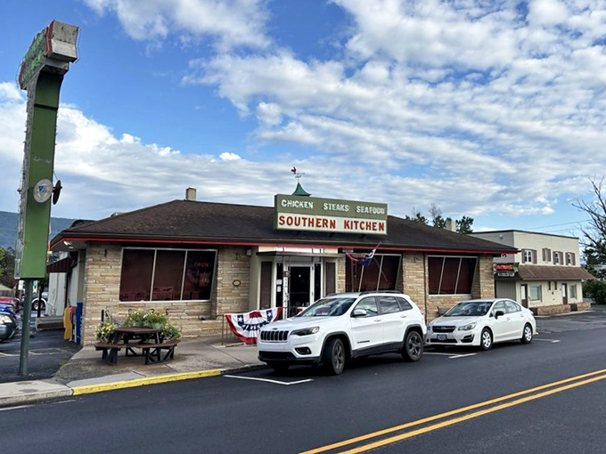 Morning light bathes this unassuming treasure in golden promise—a humble building that's fed more stories and memories than most five-star establishments ever will.