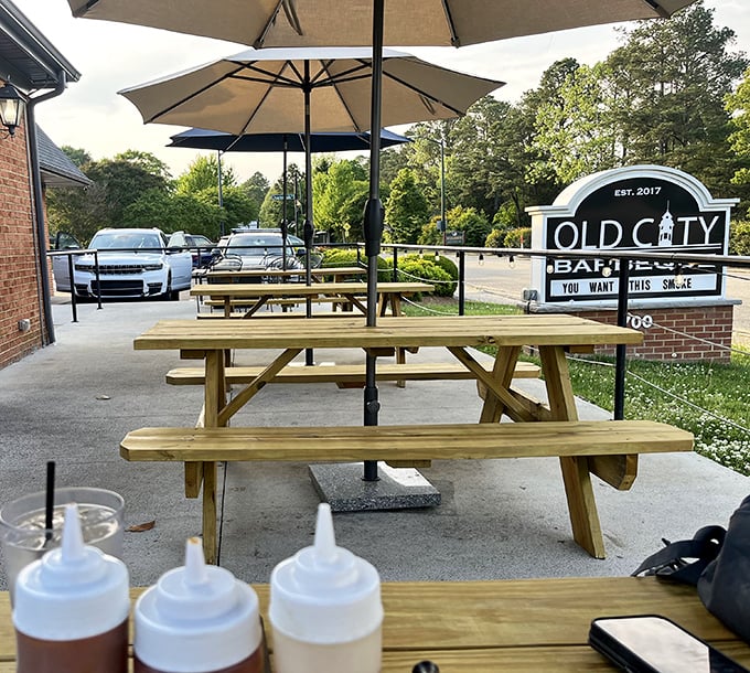 Outdoor dining with sauce bottles at the ready—because fresh air makes everything taste better, and barbecue makes fresh air smell better.