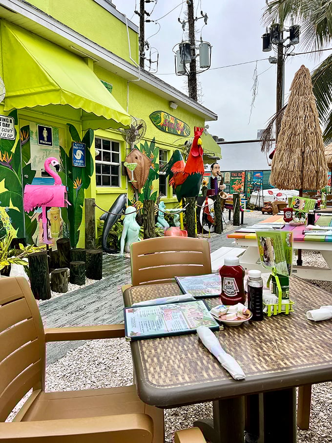 Outdoor dining where plastic flamingos and tropical decor turn breakfast into the Florida experience tourists dream about and locals treasure.