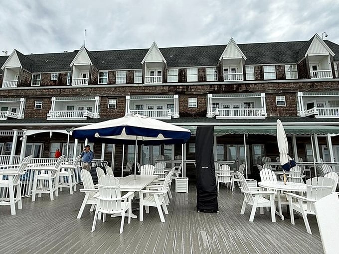 The deck offers al fresco dining with a side of sea breeze—white Adirondack chairs patiently waiting for guests to sink in and stay awhile.