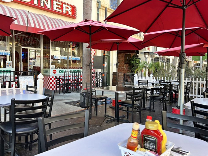 Outdoor seating for when you want fresh air with your comfort food. Those red umbrellas aren't just shade—they're landmarks for hungry travelers.