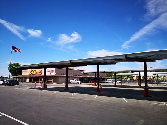The expansive parking lot tells its own story—this isn't just a restaurant, it's a destination worth driving to, where steak pilgrims gather under California skies.