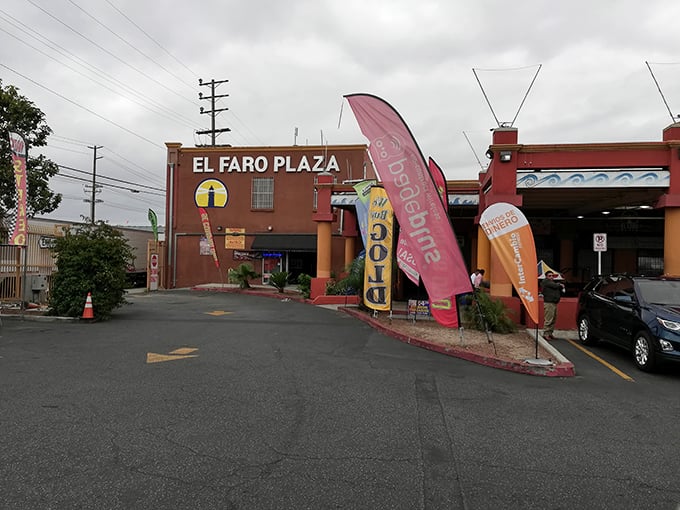 The grand entrance to El Faro Plaza stands like a portal between worlds—step inside and leave ordinary shopping behind for something far more adventurous.
