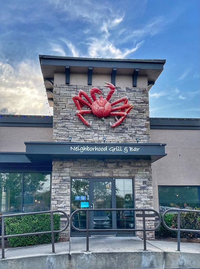 That red crab against blue sky isn't just signage—it's a beacon calling to seafood lovers like a crustacean lighthouse.