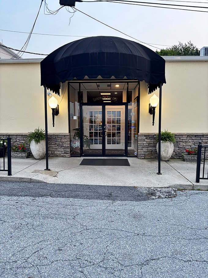 The evening entrance adds a touch of drama with its black awning and warm lighting—like the restaurant equivalent of putting on a tuxedo after dark.