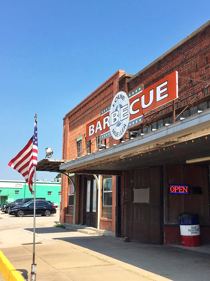 The sign that's launched a thousand road trips. That American flag isn't just patriotic – it's a symbol that great barbecue is the true national treasure. 