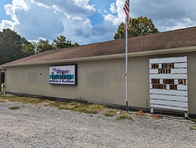 The side view reveals the diner's true character—humble, straightforward, and proudly announcing burger day like it's a national holiday.