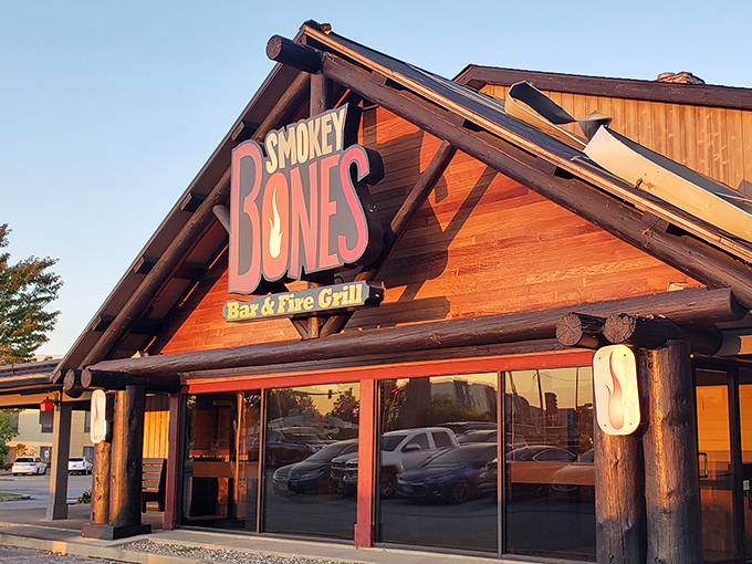 The sunset casts a warm glow on the Smokey Bones sign—nature's way of highlighting where you should be heading for dinner tonight.