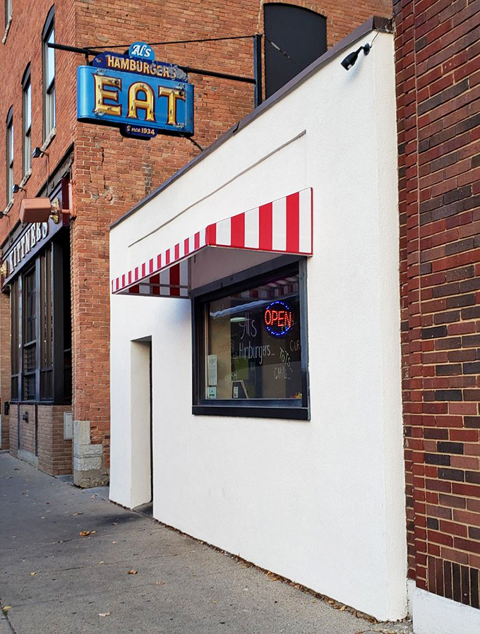 That red and white awning isn't just charming—it's a beacon of hope for anyone who believes simple food done right still matters in this complicated world.
