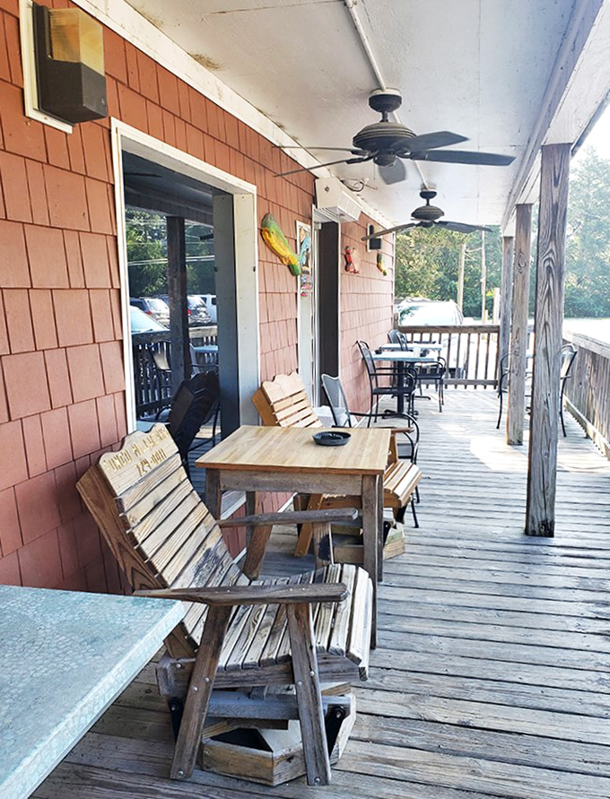 The weathered porch offers a moment of quiet contemplation before the seafood storm inside – or a place to loosen your belt afterward.