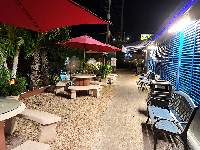 Outside, red umbrellas and palm trees create a perfect waiting area to contemplate the important question: key lime pie or piña colada?