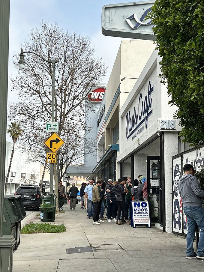 The sidewalk queue has become as much a part of the Moo's experience as the food itself—a community of strangers united by the promise of perfect barbecue.