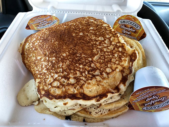 These pancakes aren't just big—they're the fluffy golden discs of joy that make you question why anyone would ever choose a green smoothie over carbohydrate bliss.