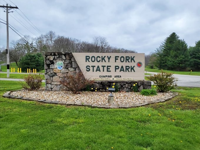 The welcoming stone entrance sign to Rocky Fork State Park – where Ohio's natural beauty awaits just beyond this humble herald.