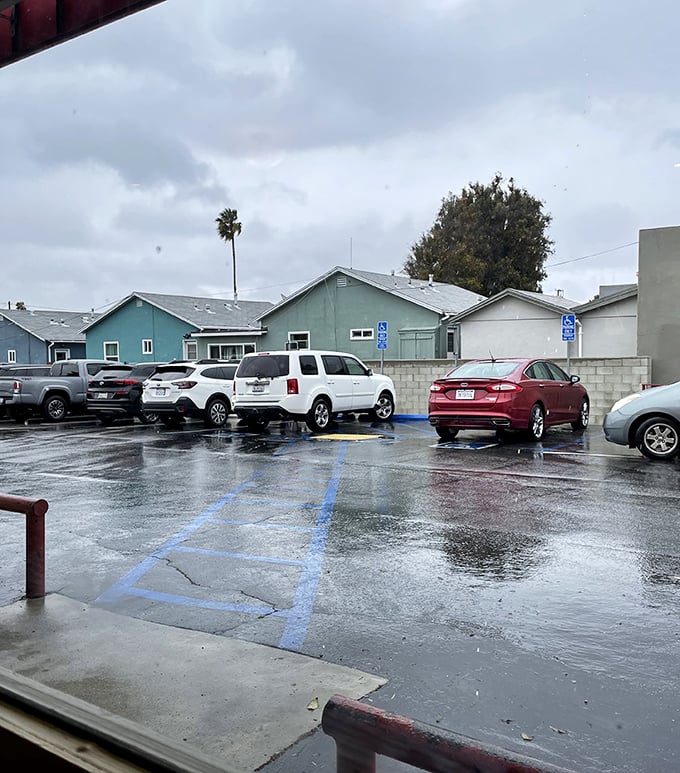 Even on rainy days, the parking lot stays busy—proof that neither weather nor changing times can dampen Hot 'n Tot's enduring appeal.