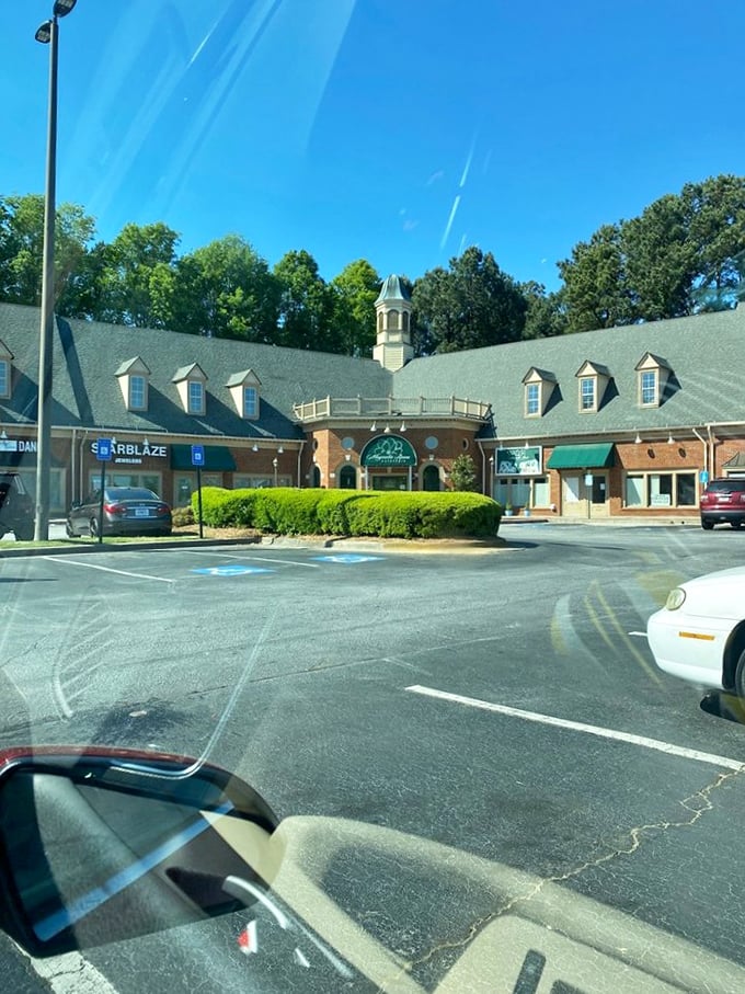 The charming exterior, viewed from the parking lot, shows the full scope of this Tucker treasure—a temple of Southern cuisine nestled among Georgia pines.