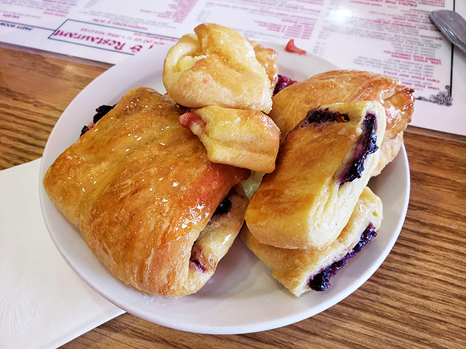 These pastries aren't just baked goods—they're edible sunshine. Flaky, golden, and jam-filled, they're the perfect sweet ending to a savory breakfast feast.