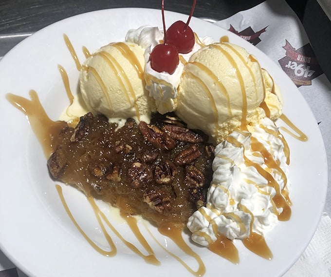 Pecan pie that doesn't just end your meal – it provides closure with a sweet epilogue of vanilla ice cream and caramel drizzle worthy of a standing ovation.