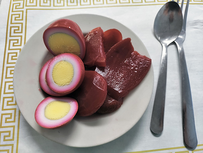 Pickled eggs and beets—the purple-pink delicacy that separates the tourists from the locals. Consider it an edible merit badge of Midwestern food appreciation.