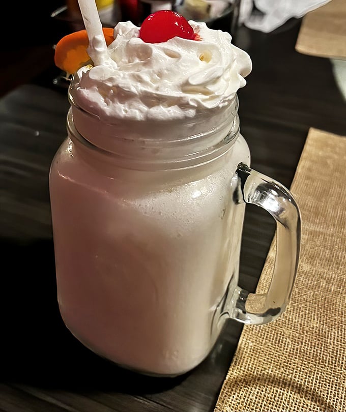 This creamy piña colada topped with whipped cream and a cherry is vacation in a glass—the perfect sweet ending to your seafood feast.