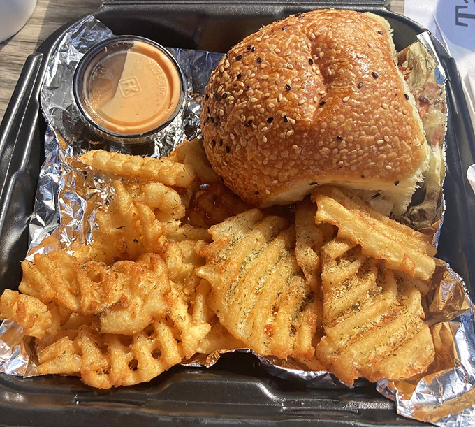 A sandwich that demands to be the center of attention, with waffle fries that aren't just sides—they're supporting actors worthy of their own spin-off.