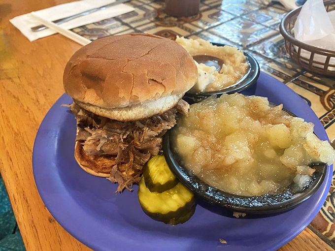 Pulled pork sandwich perfection accompanied by sides that could easily steal the show on their own.
