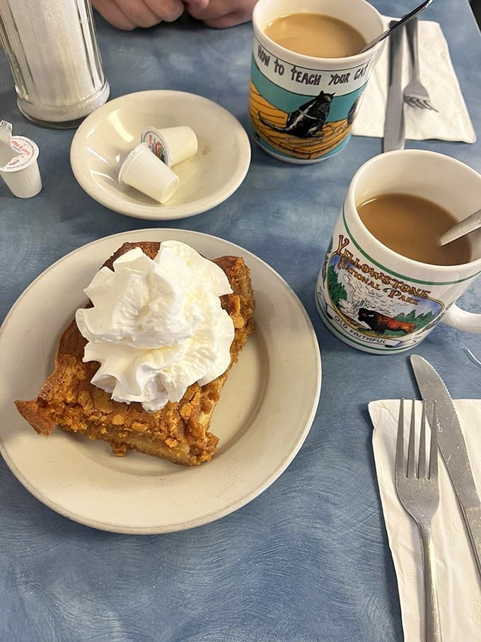 Not just dessert, not just breakfast—this pumpkin bread pudding topped with whipped cream is what morning glory looks like on a plate.