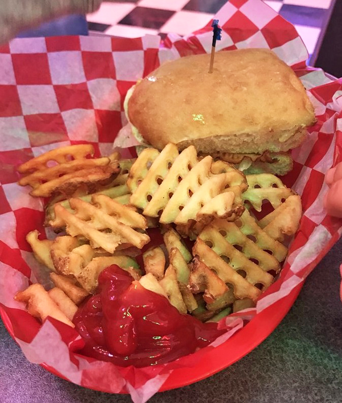 The waffle fries and sandwich combo that answers the eternal question: "Why choose between crispy potatoes and a hearty sandwich when you can have both?" Ketchup puddles await their delicious destiny.