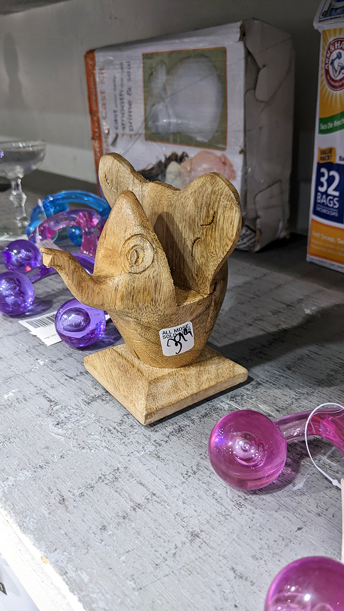 A wooden fish napkin holder that somehow manages to be both charming and slightly puzzling—the quintessential thrift store find.
