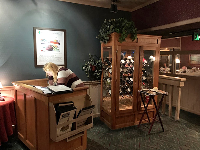 The host station and wine display—your first hint that this place takes both hospitality and proper wine storage seriously.