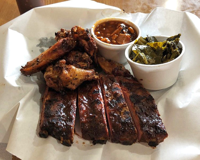 The barbecue sampler that makes decision-making unnecessary. Ribs, wings, and sides—it's like the greatest hits album of smoked meat classics.