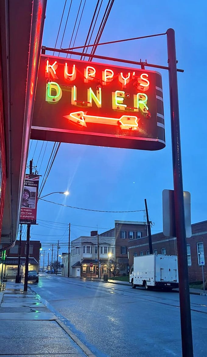 When that neon glows against the twilight sky, it's not just a sign—it's a beacon calling you home to comfort.