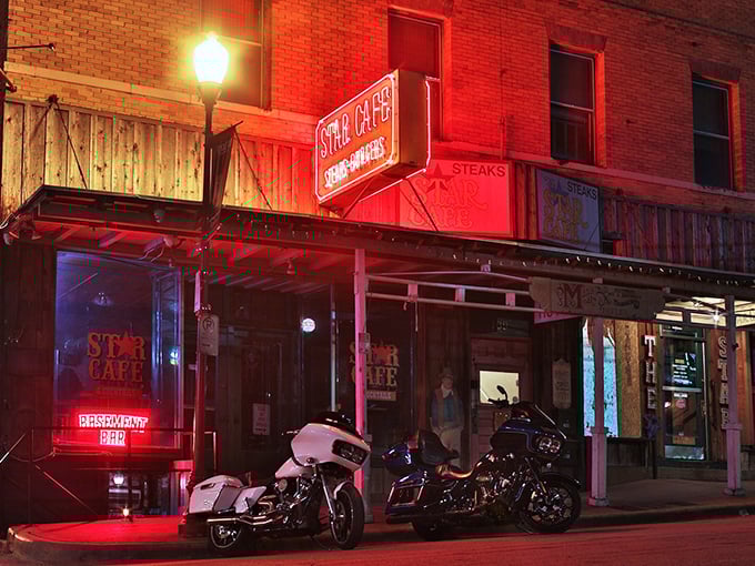 As night falls, the neon glow of Star Cafe beckons hungry souls like a lighthouse for those navigating the seas of mediocre dining options.