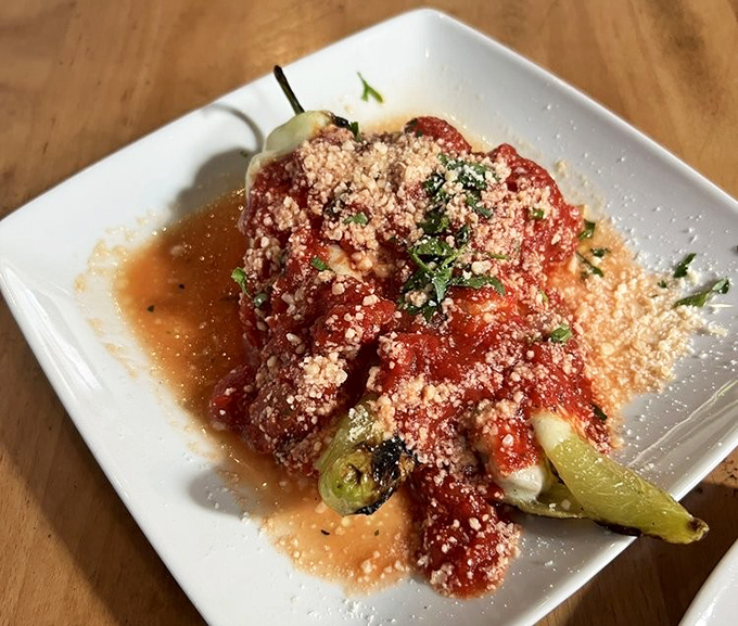 These aren't just peppers – they're sweet vessels of tomato sauce and parmesan that make vegetarians feel like they've won the culinary lottery.