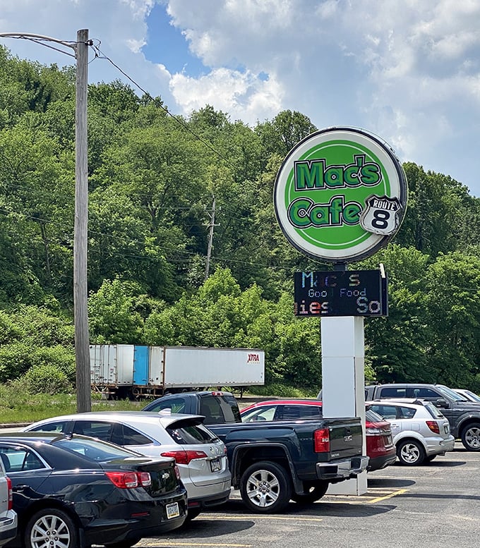The roadside sign that's guided hungry travelers to hash brown heaven for years, standing tall against Pennsylvania greenery like a beacon of breakfast hope.