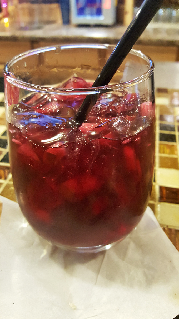 Ruby-red sangria that catches the light like a jewel – this fruit-forward sipper is the perfect companion to any seafood feast.