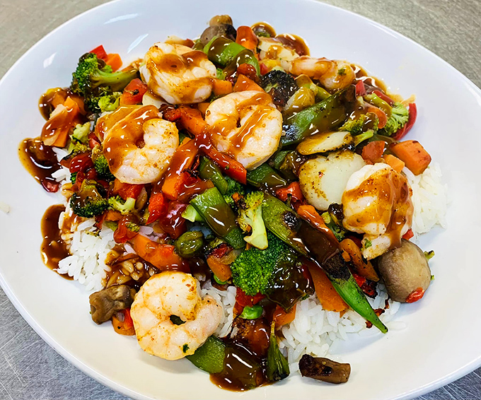 Shrimp stir-fry that brings unexpected global flair to rural Pennsylvania—plump seafood and vibrant vegetables playing happily together on a bed of rice.
