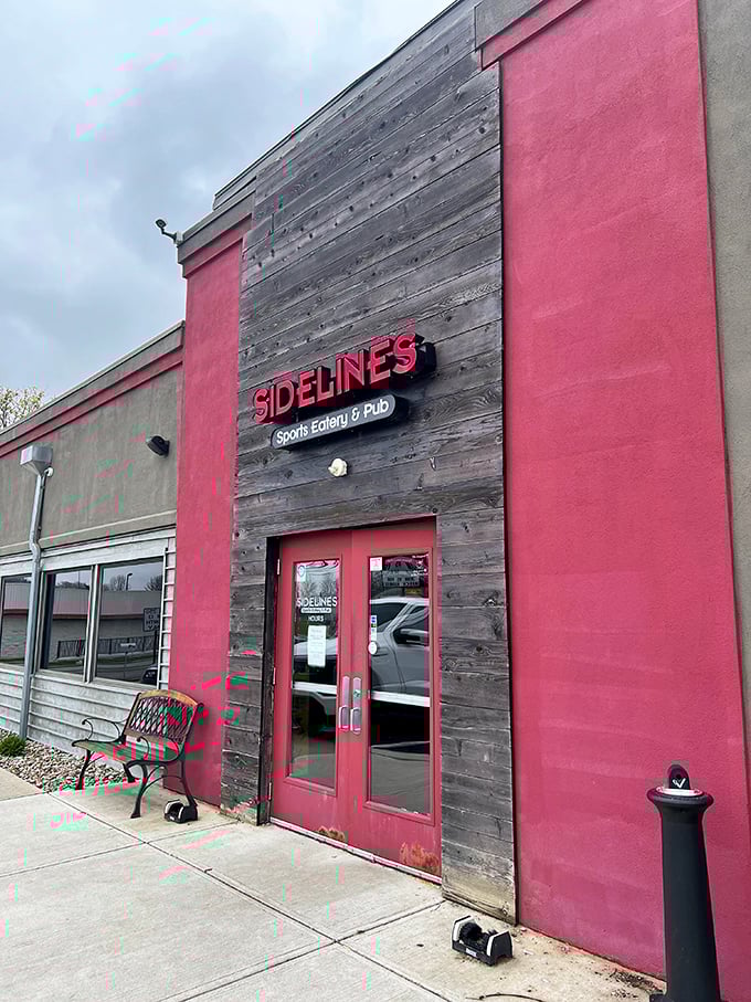 Sidelines combines rustic wood with contemporary design, proving sports bars can have architectural ambition. That bench invites pre-game strategy sessions.